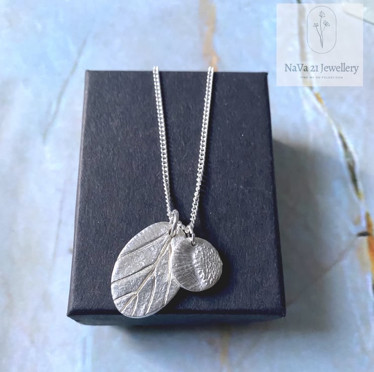 Silver leaf textured pendant with a small flowe... - Folksy