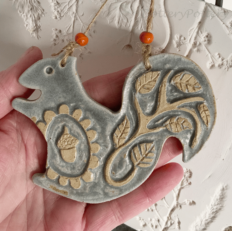 Ceramic squirrel decoration with carved design - Folksy