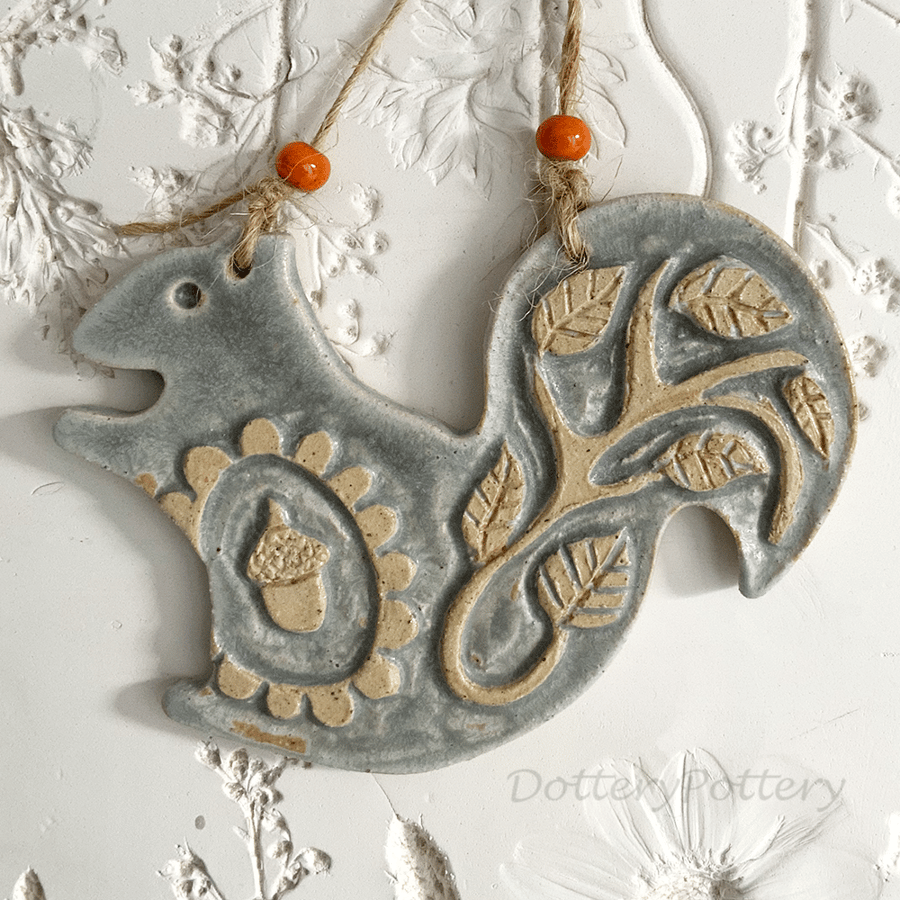Ceramic squirrel decoration with carved design - Folksy