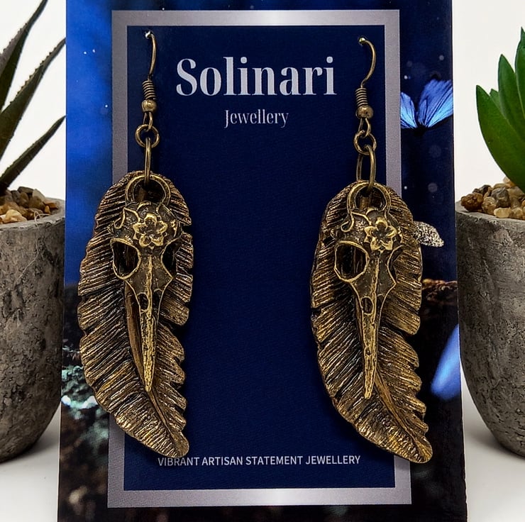 Bird skull and feather statement earrings in an... - Folksy