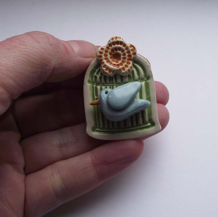 Little ceramic bird cage brooch with flower. Po... - Folksy