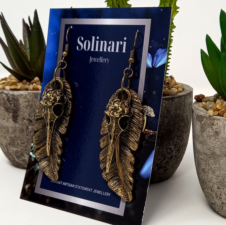 Bird skull and feather statement earrings in an... - Folksy