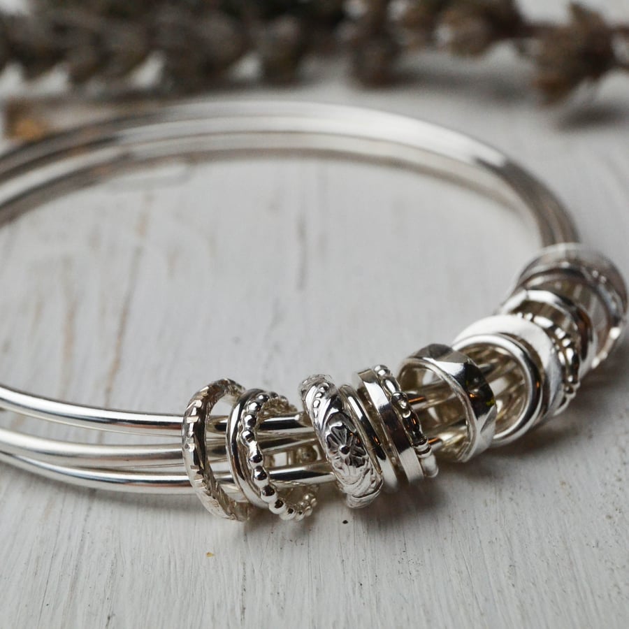 Three bangles with silver charms - Folksy