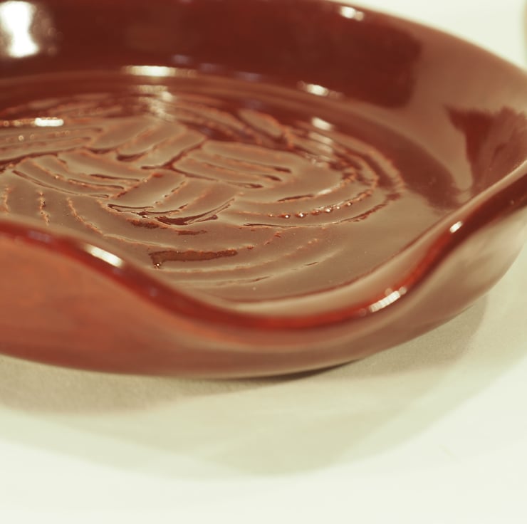 Red handmade ceramic spoonrest with knot design - Folksy