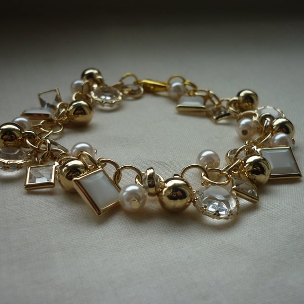 GOLD, CRYSTAL AND PEARL FANCY CHARM BRACELET. ... - Folksy