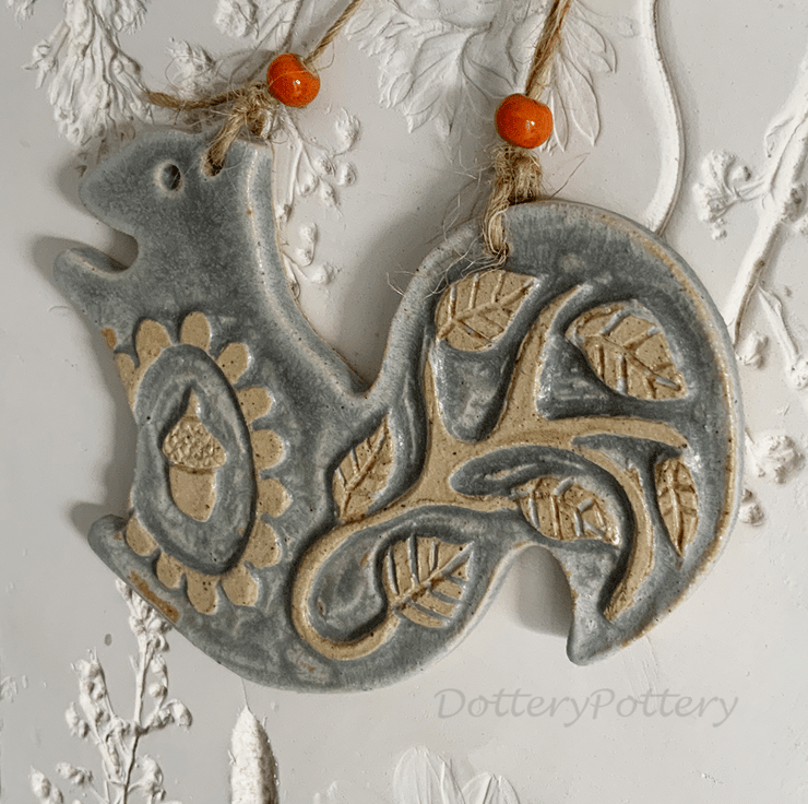 Ceramic squirrel decoration with carved design - Folksy