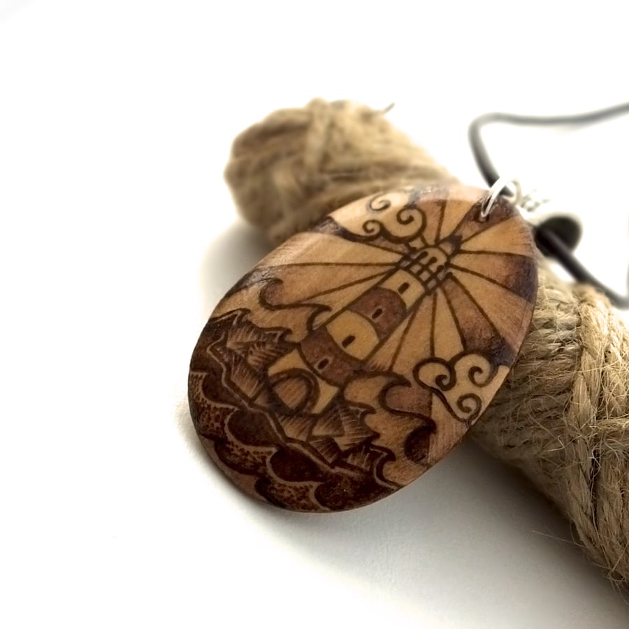 Striking lighthouse shining pyrography pendant ... - Folksy