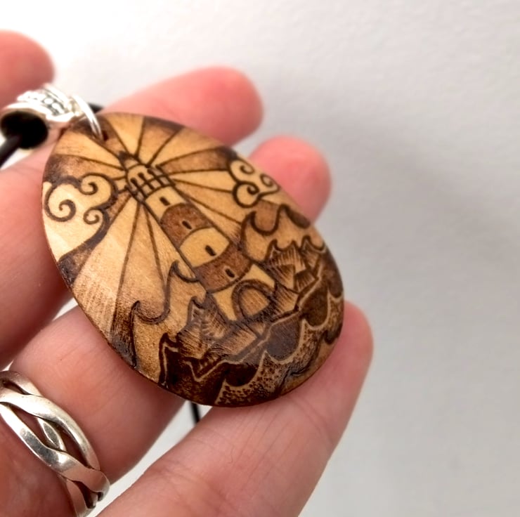 Striking lighthouse shining pyrography pendant ... - Folksy