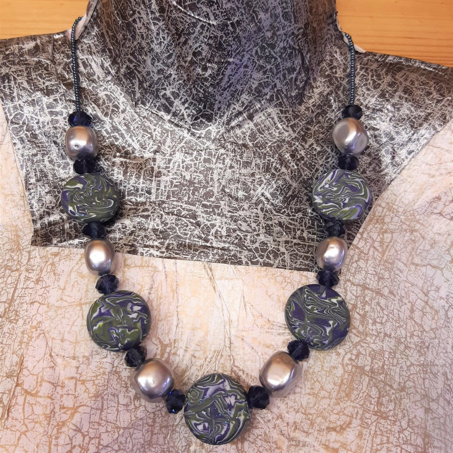 Distinctive disc shaped polymer clay necklace - Folksy