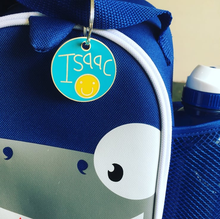 A personalised bag tag in resin and metal - Folksy