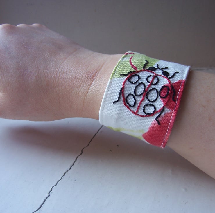 Hand embroidered textile cuff with ladybird and... - Folksy