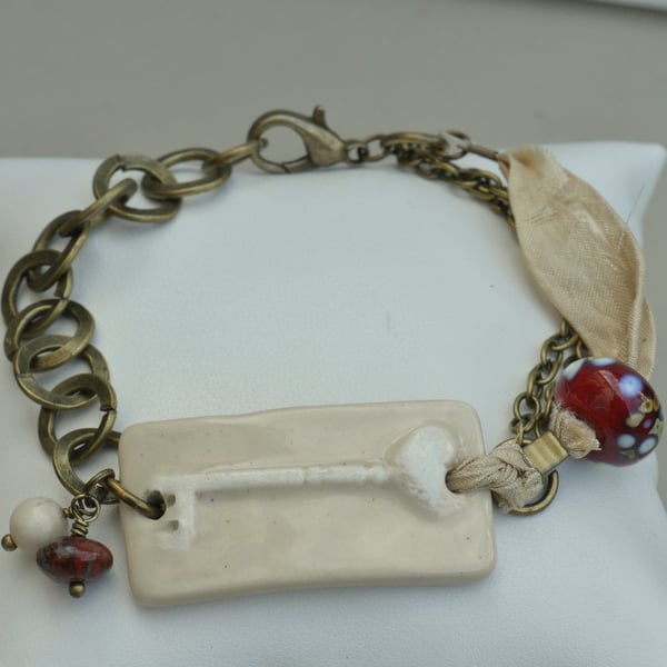 Handmade Cream Ceramic Key Bar with Lampwork Gl... - Folksy