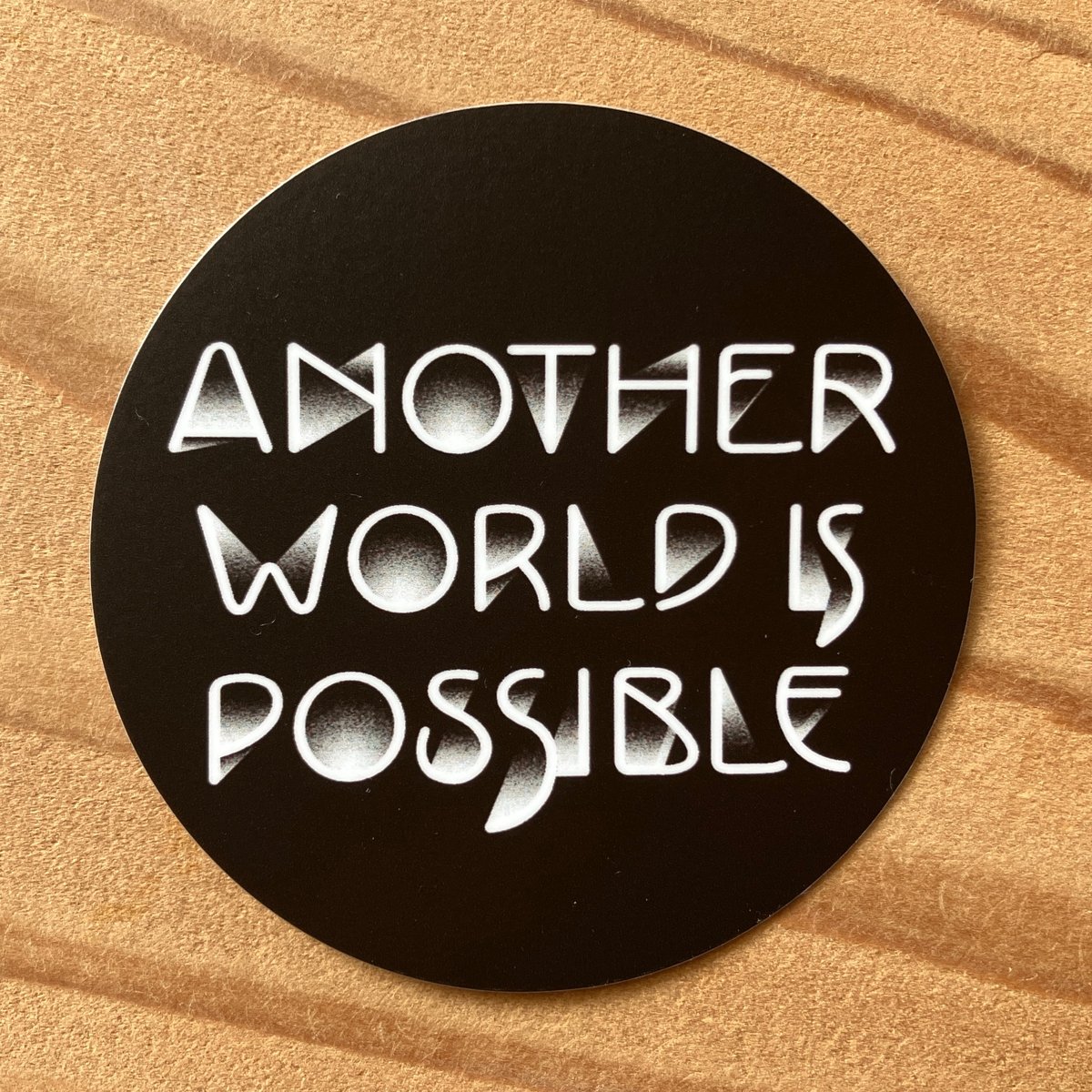 ステッカー：ANOTHER WORLD IS POSSIBLE 黒 | tempura books