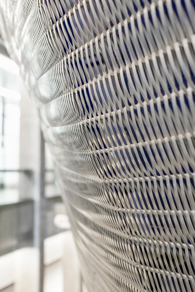 Architectural spiral fabric shrouds whale-shaped concert hall