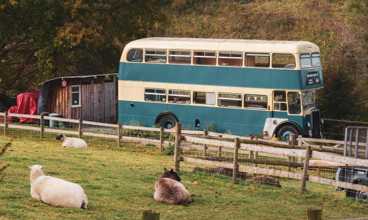 You can now live inside a double-decker bus on a lush farm in Wales ...
