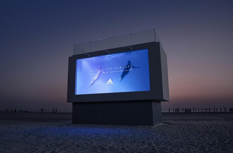 Adidas invites women to dive into its first liquid billboard in Dubai ...