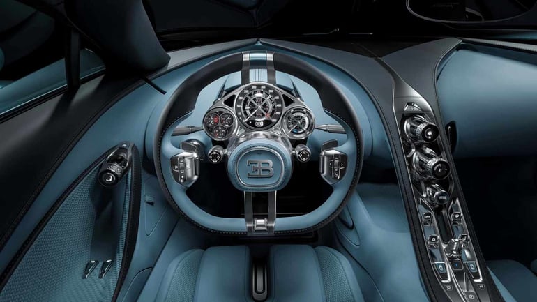 By using a mechanical watch-inspired analog gauge cluster instead of a ...