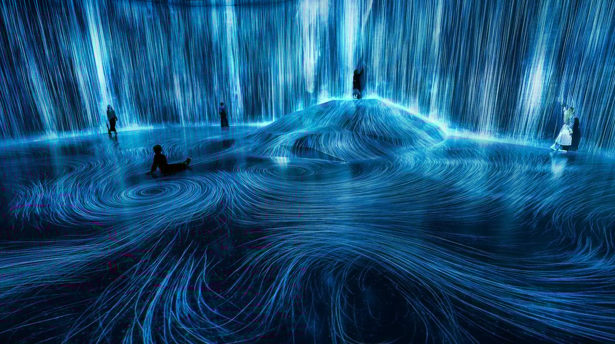 Universe of Water Particles on a Rock where People Gather | teamLab