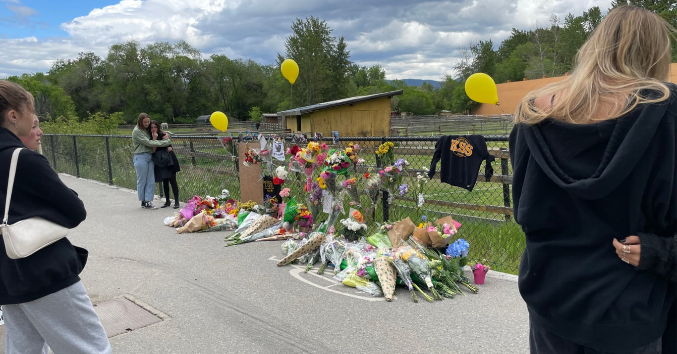 Dozens of students mourn fallen classmates at growing crash-site memorial