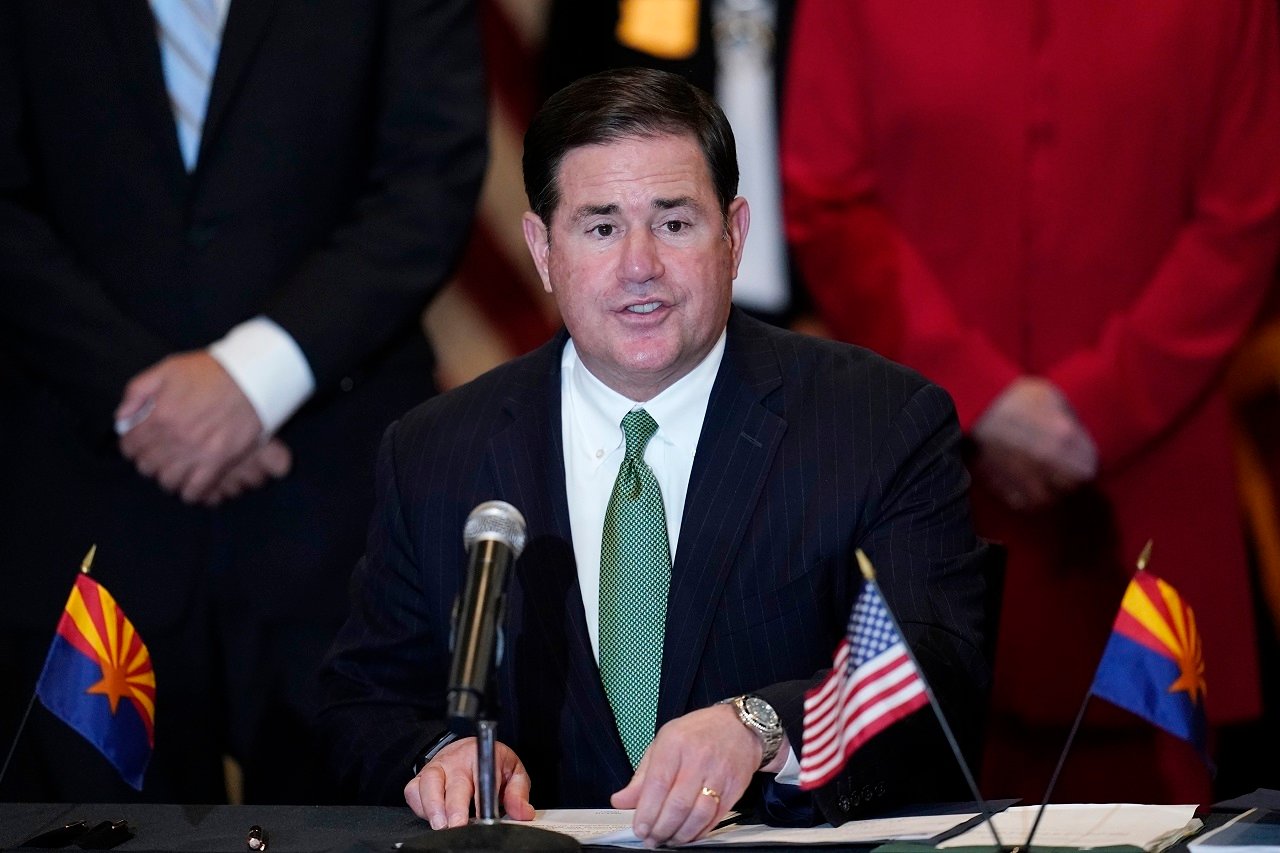 Arizona governor signs a lineup of Covid-19 and election reform bills ...