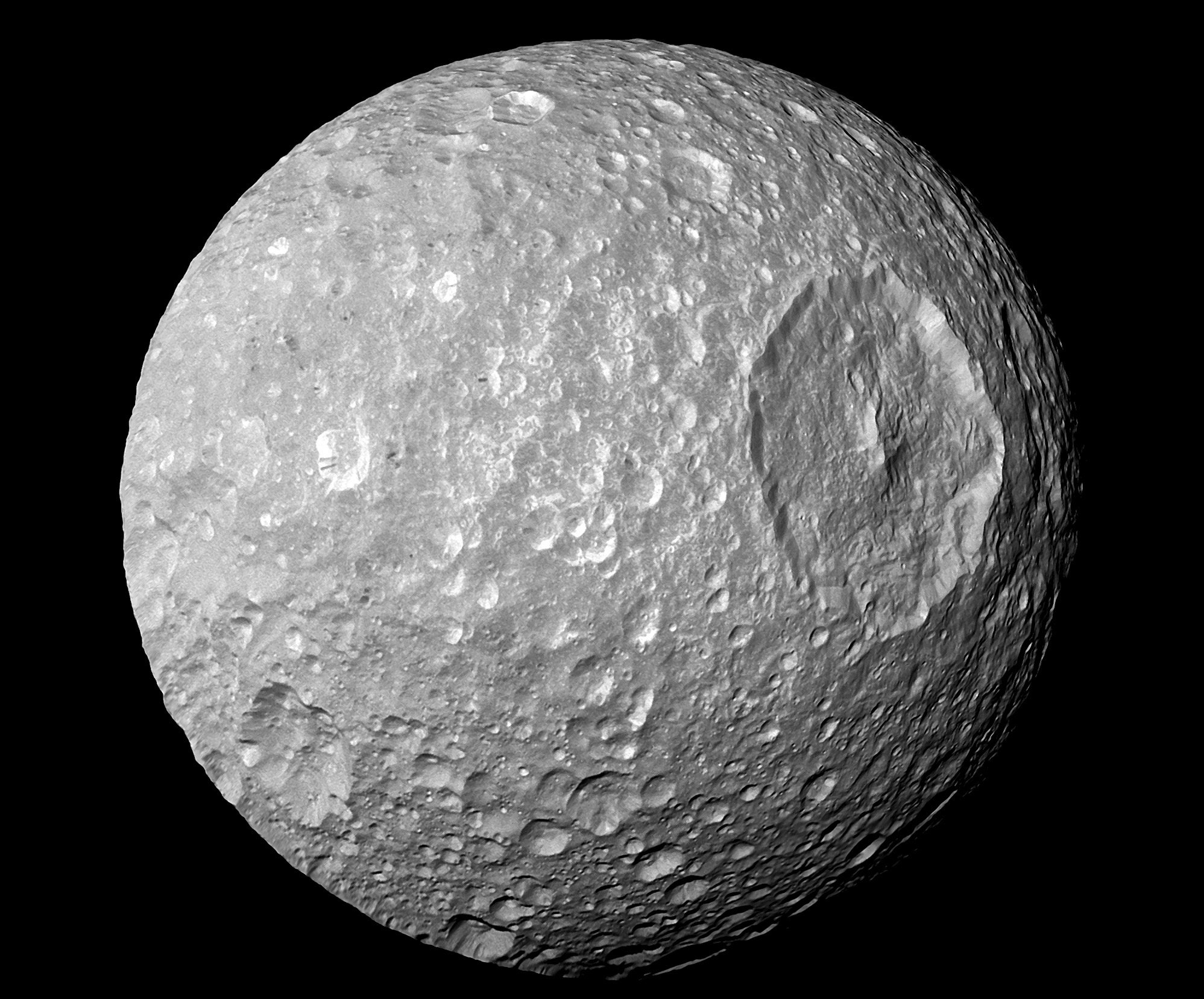 Saturn’s Death Star-looking moon may have vast underground ocean ...