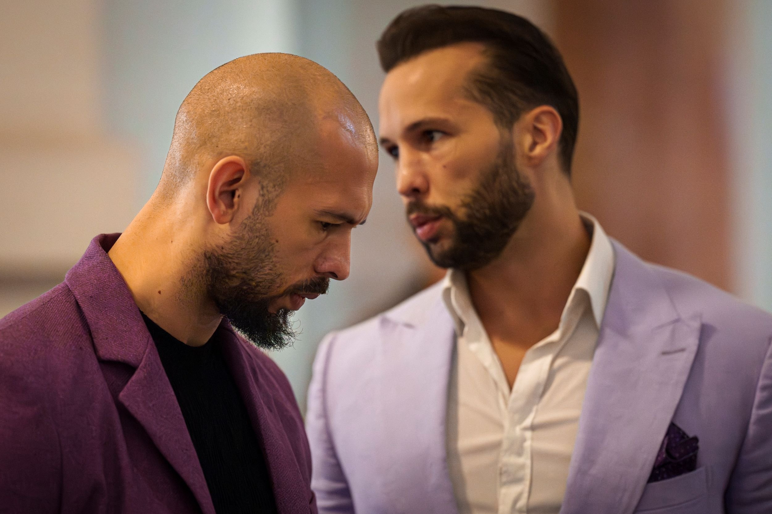 Influencer Tate brothers, who face human trafficking charges in Romania, arrive in the US ...