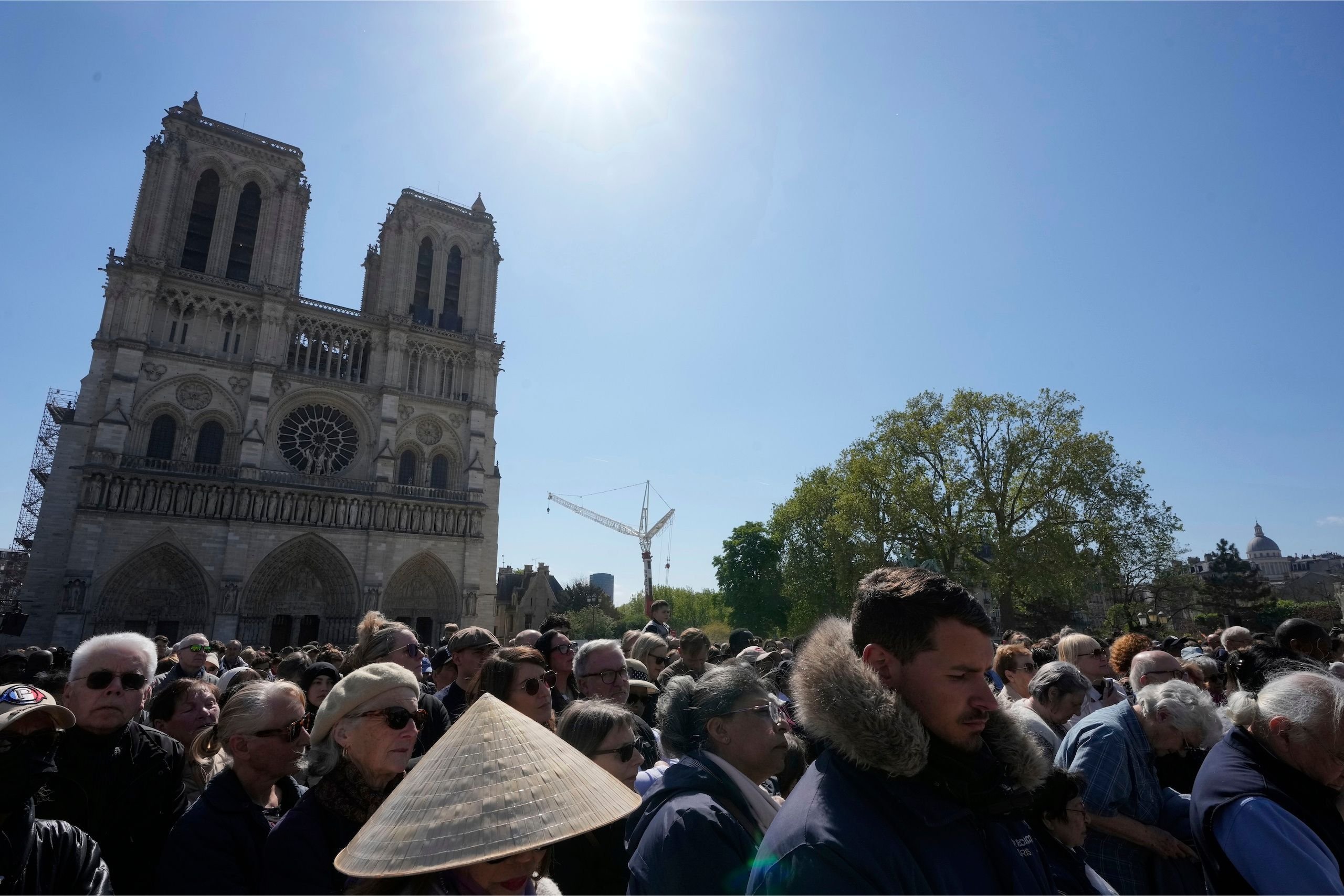 Worshippers return to restored Notre Dame for Easter rituals with ...