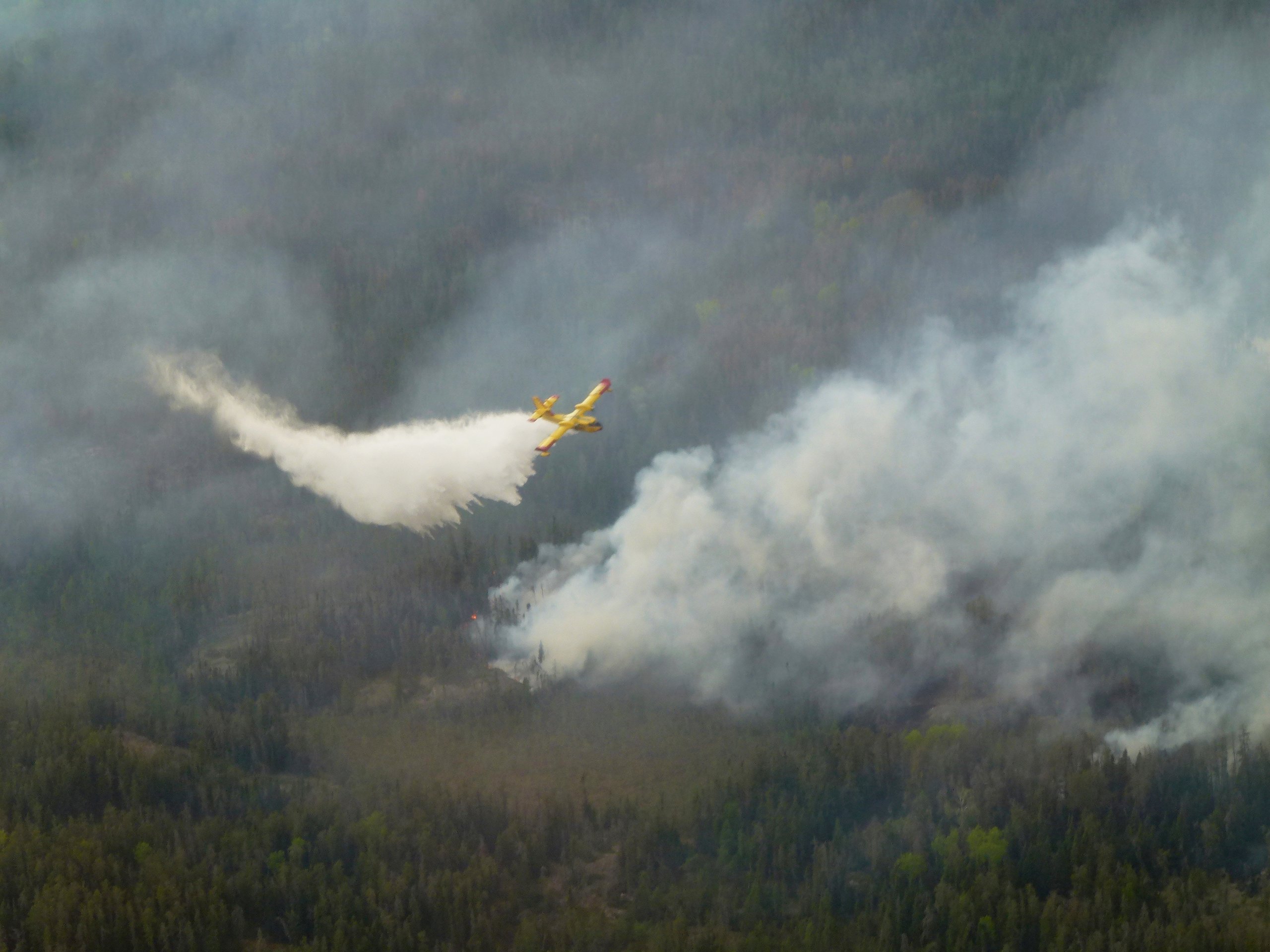 Wildfires burning across central Canada force additional evacuation ...