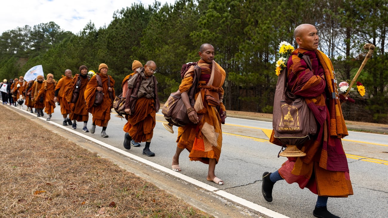 Buddhist monks persist in peace walk despite injuries as thousands follow them on social media ...